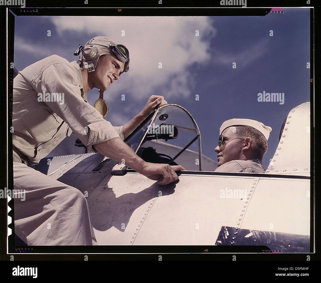 This 1942 photograph shows Ensign Noressey and a cadet participating in ...