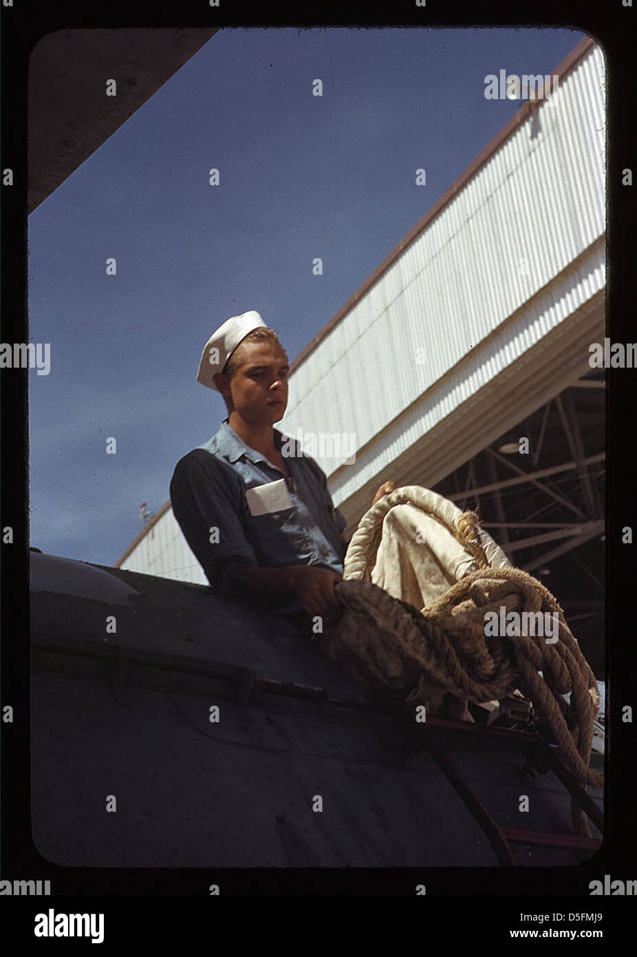 A sailor mechanic inspects a PBY Catalina flying boat at the Naval Air ...