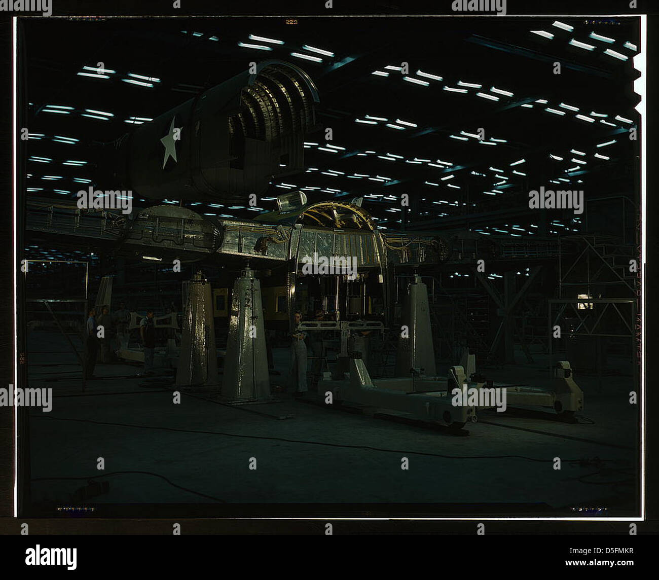 A photograph showing the assembly of a transport plane at the ...