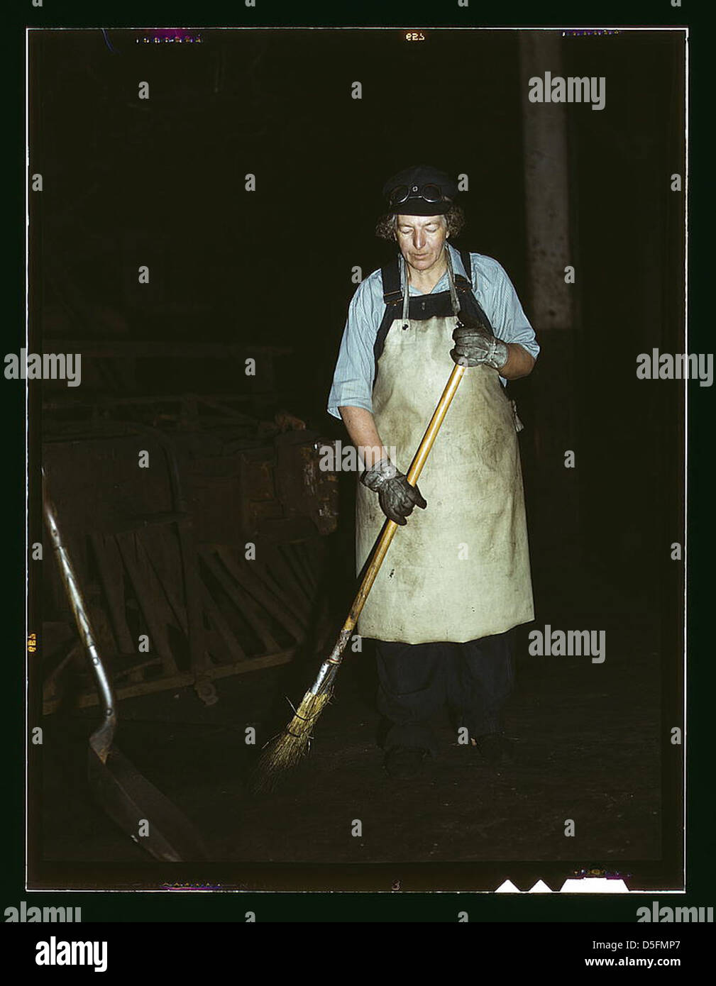 Mrs. Elibia Siematter is pictured working as a sweeper at a roundhouse ...