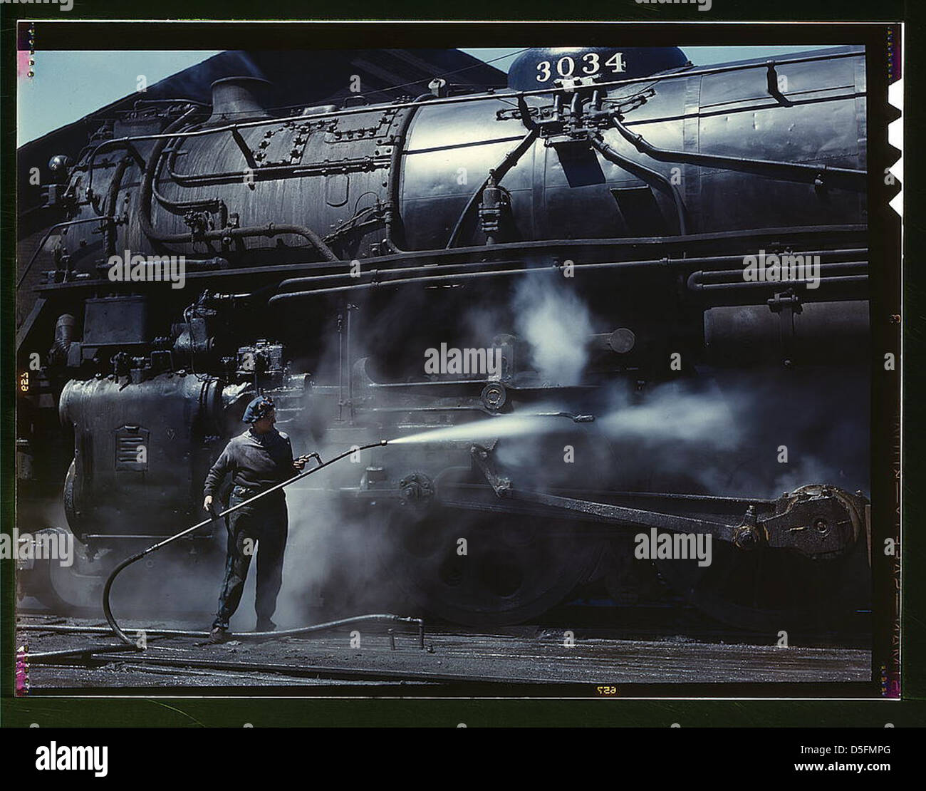 In Clinton, Iowa, Mrs. Viola Sievers cleans a giant 'H' class steam ...