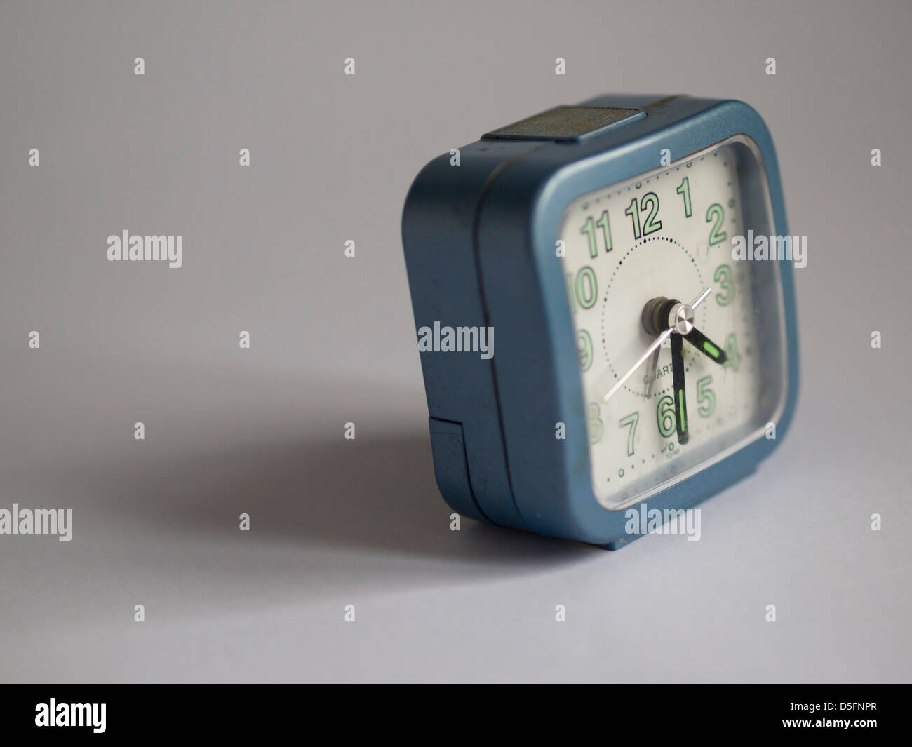 Blue alarm clock Stock Photo - Alamy