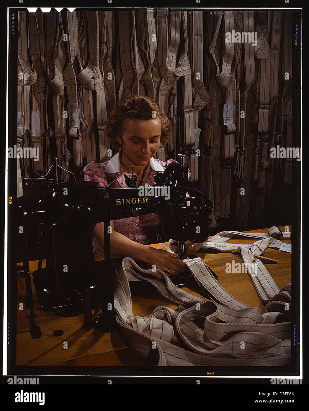 A photograph from 1942 shows Mary Saverick stitching harnesses at the ...