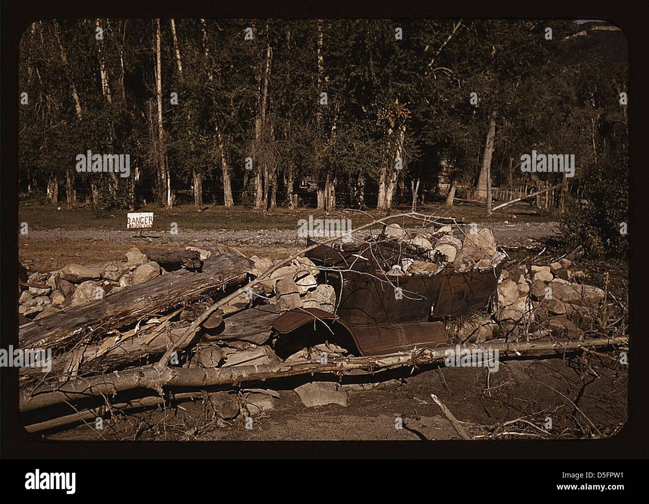 This photograph depicts an improvised stream bank protection system ...