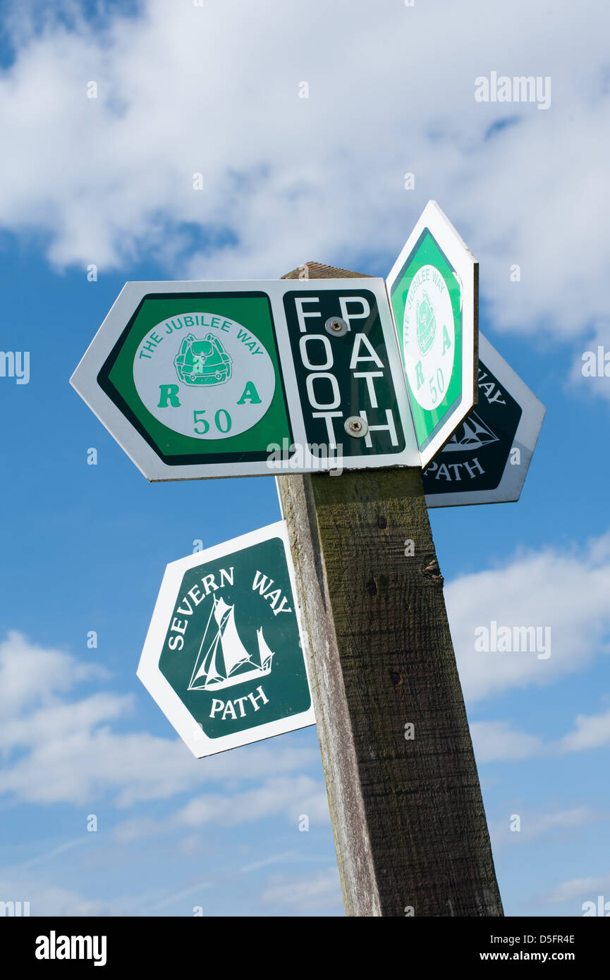 Blue skies behind a footpath signpost on the Severn Way Path and the ...