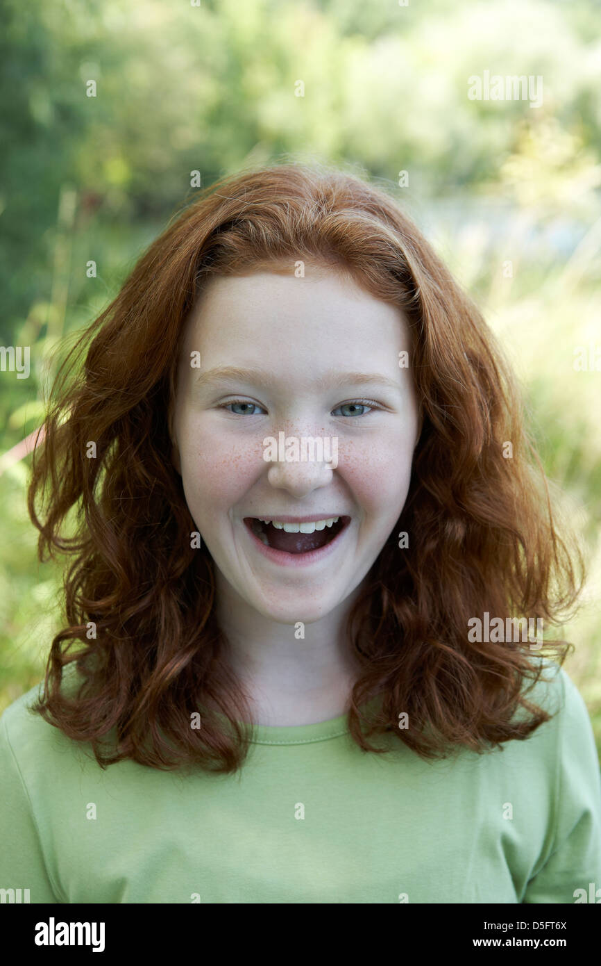 Red haired girl laughing Stock Photo - Alamy