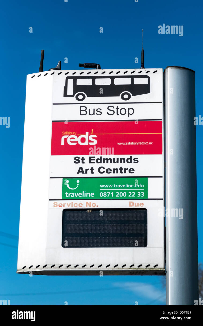 Looking up at electronic bus stop sign against blue sky Stock Photo - Alamy