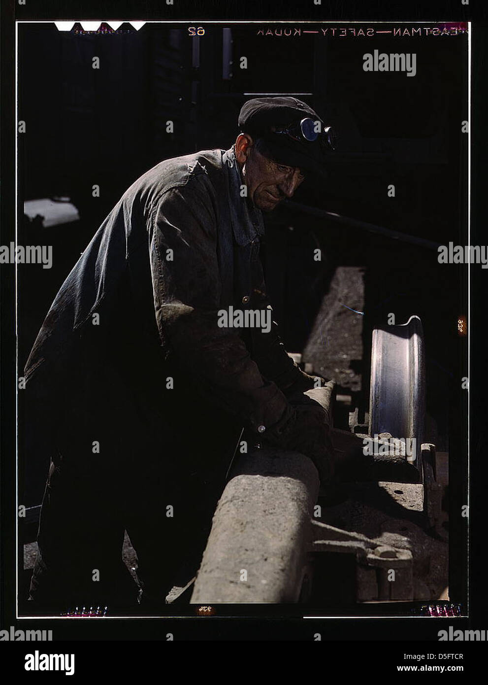 Sam Cell is photographed working on the truck of a car at the rip ...