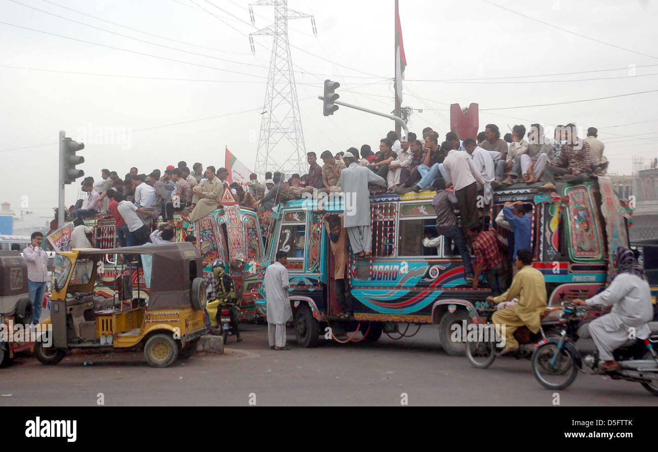 Passengers travel on an overload bus due to non-availability of ...