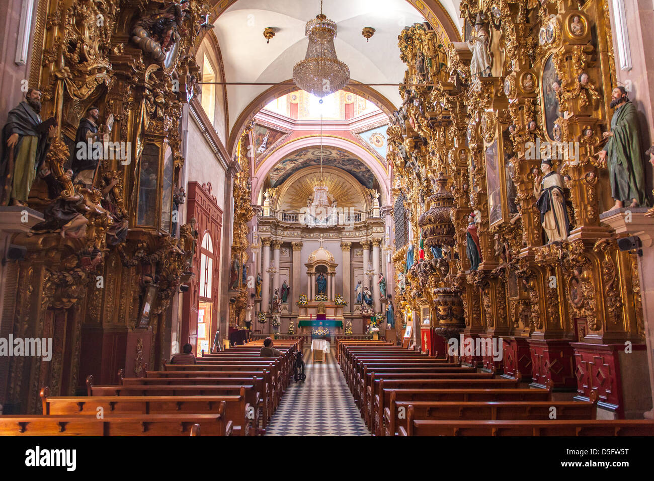 Ornate, gold interior of the Church of the Monastery of Santa Clara of ...