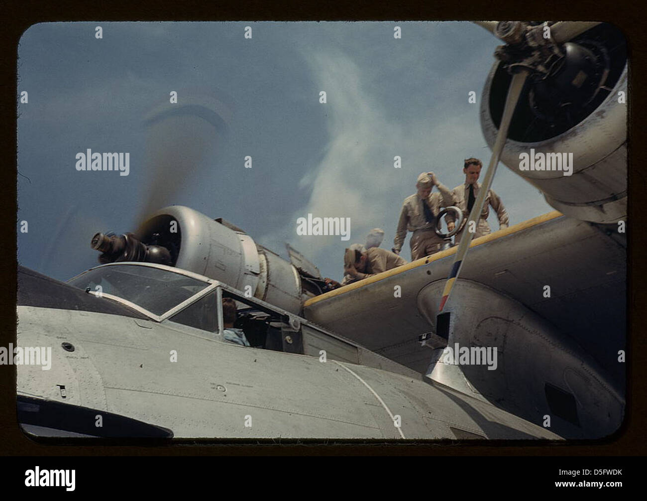 A propeller is started on a PBY Catalina aircraft at the Naval Air Base ...