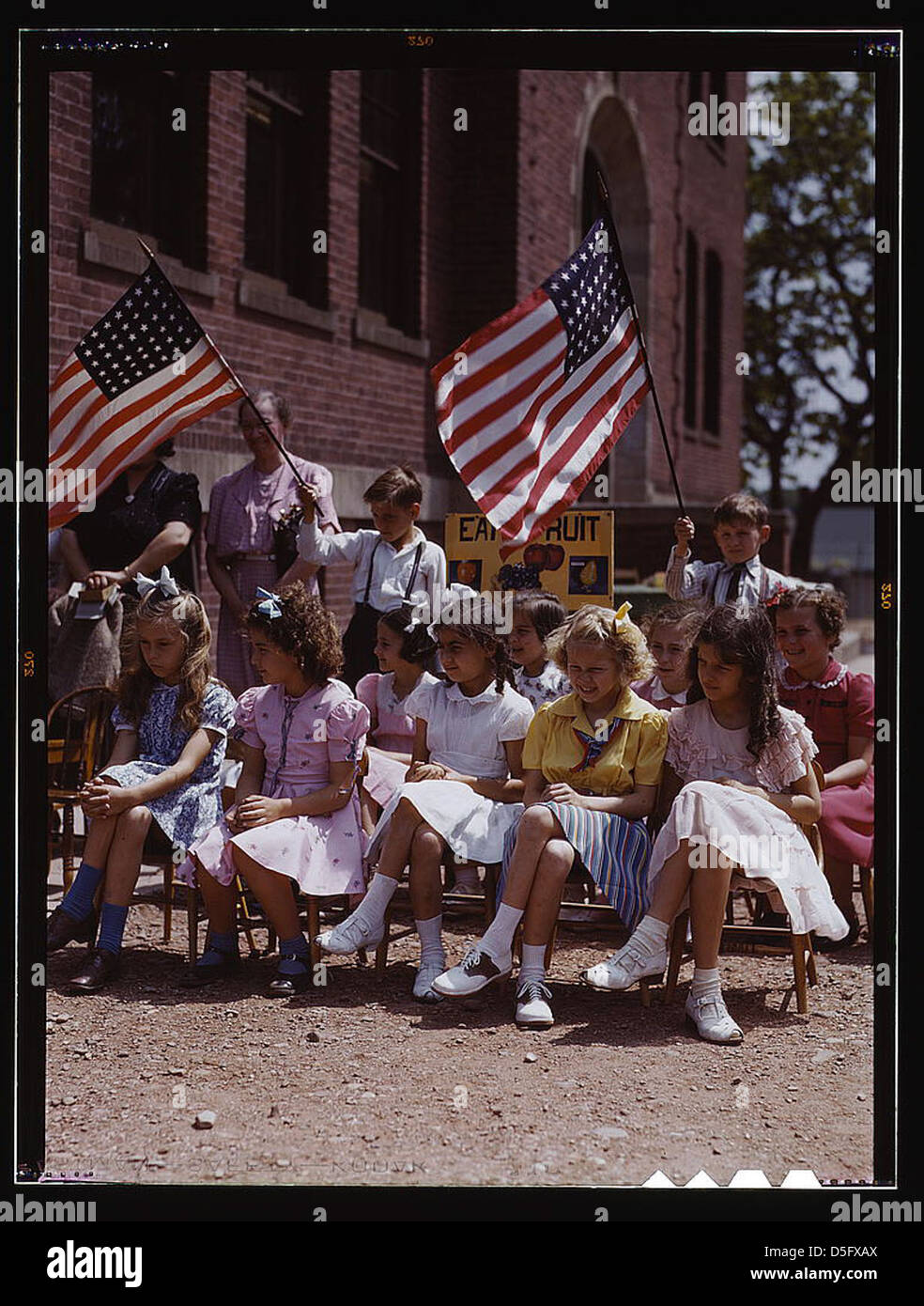 A 1942 photograph depicting school children of Polish and Italian ...