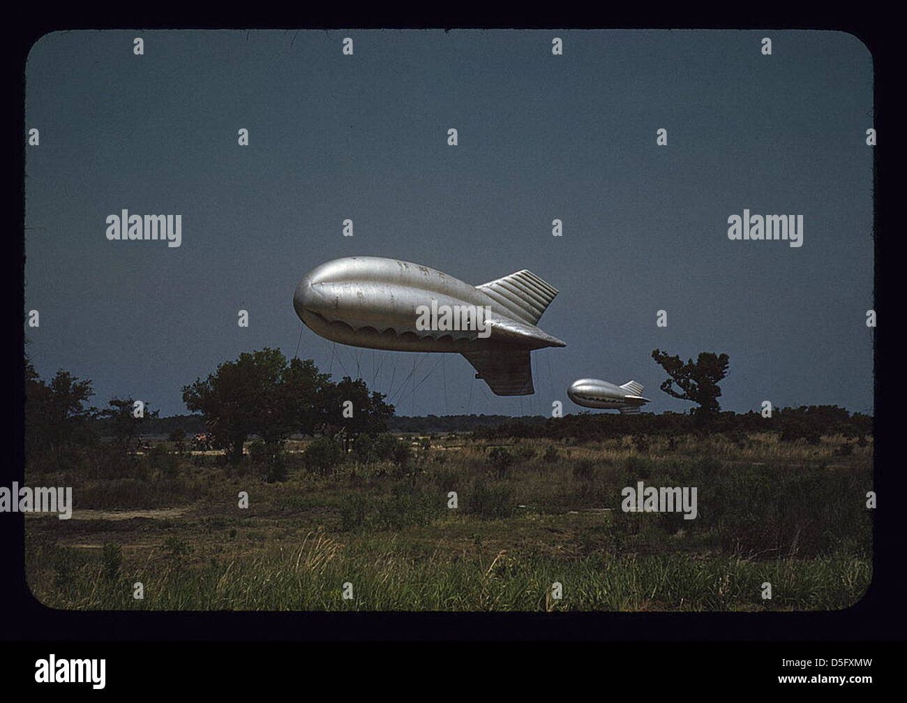 A 1940s photograph showing Marine Corps personnel handling barrage ...