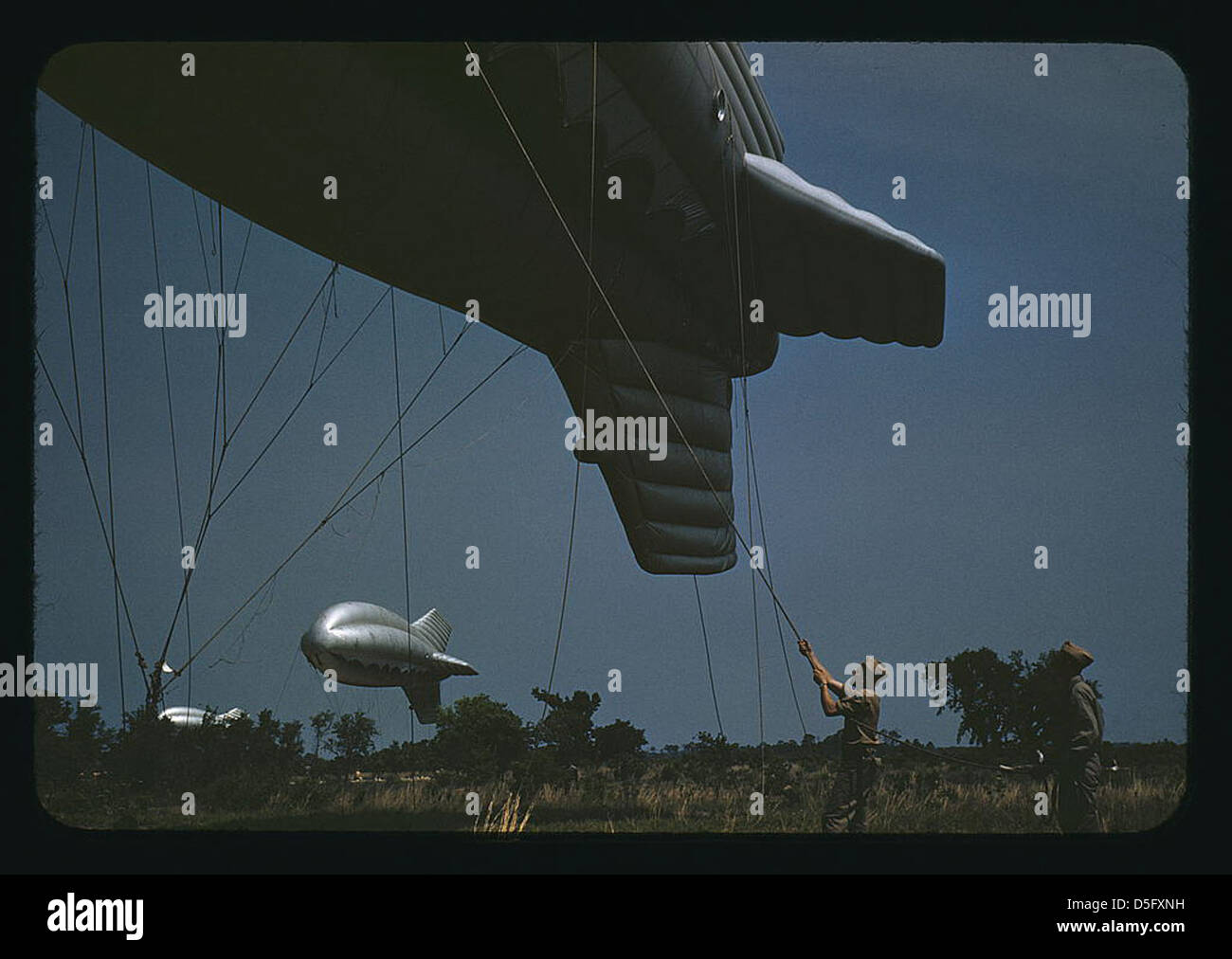 A 1942 photograph shows Marines managing barrage balloons on Parris ...