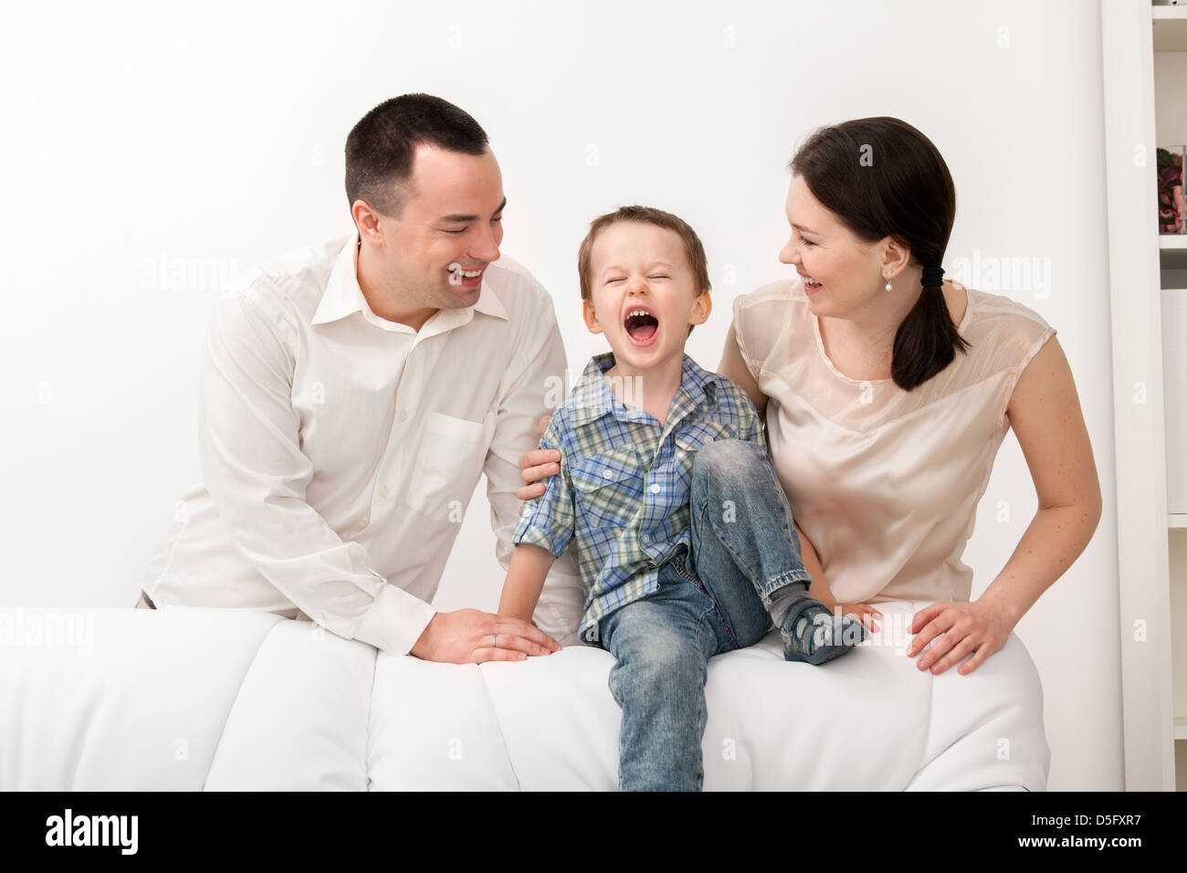 Happy family on white background Stock Photo - Alamy