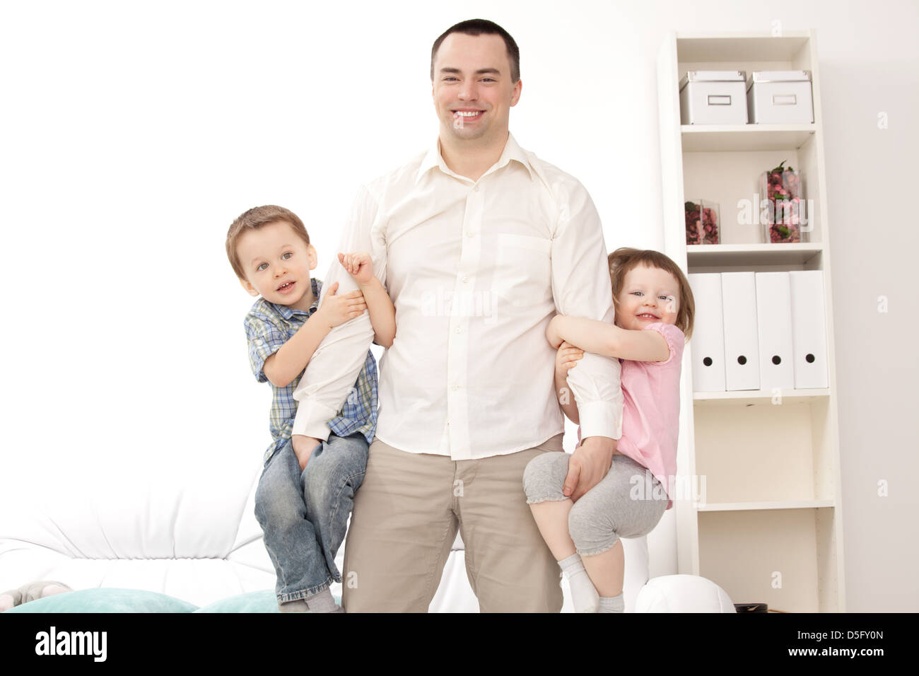Portrait of a happy young guy with kids Stock Photo - Alamy