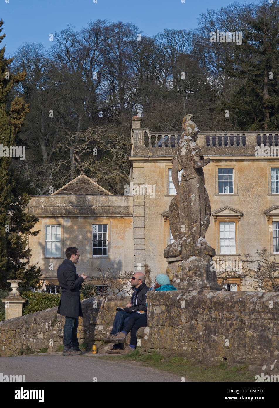 TOURIST SIT BY STATUE OF BRITANNIA OPPOSITE IFORD MANOR HOUSE IN ...