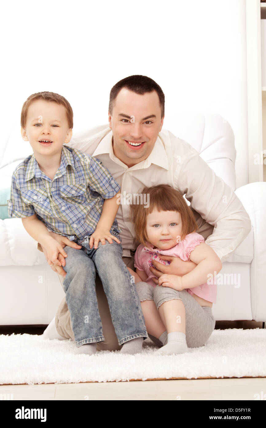 Portrait of a happy young guy with kids Stock Photo - Alamy
