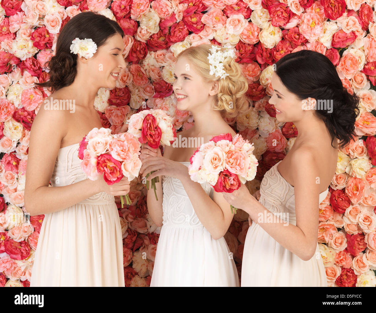 three women with background full of roses Stock Photo - Alamy