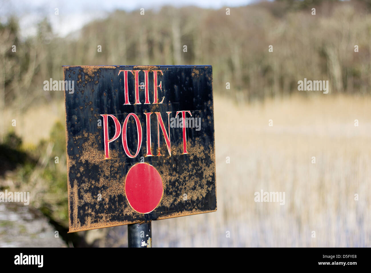 Assembly point signpost in open setting Stock Photo - Alamy
