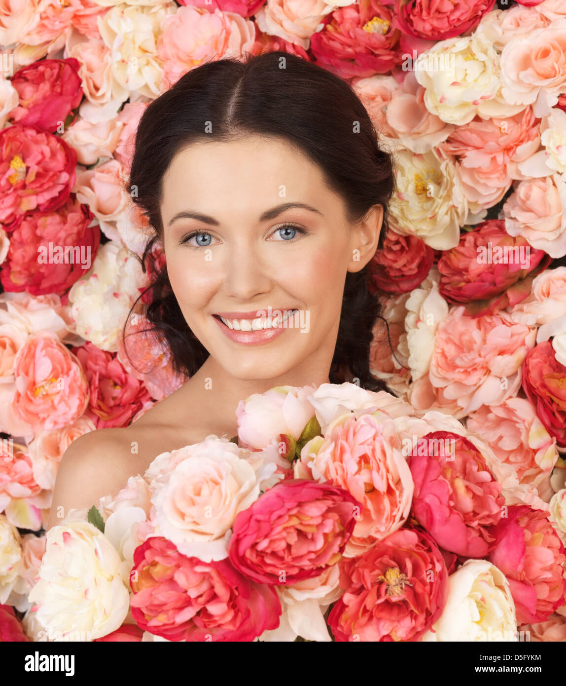 woman with background full of roses Stock Photo - Alamy