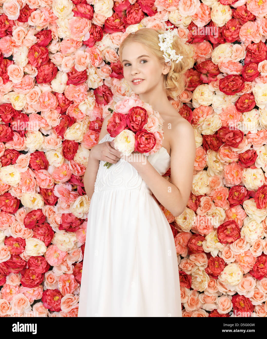 woman with bouquet and background full of roses Stock Photo - Alamy