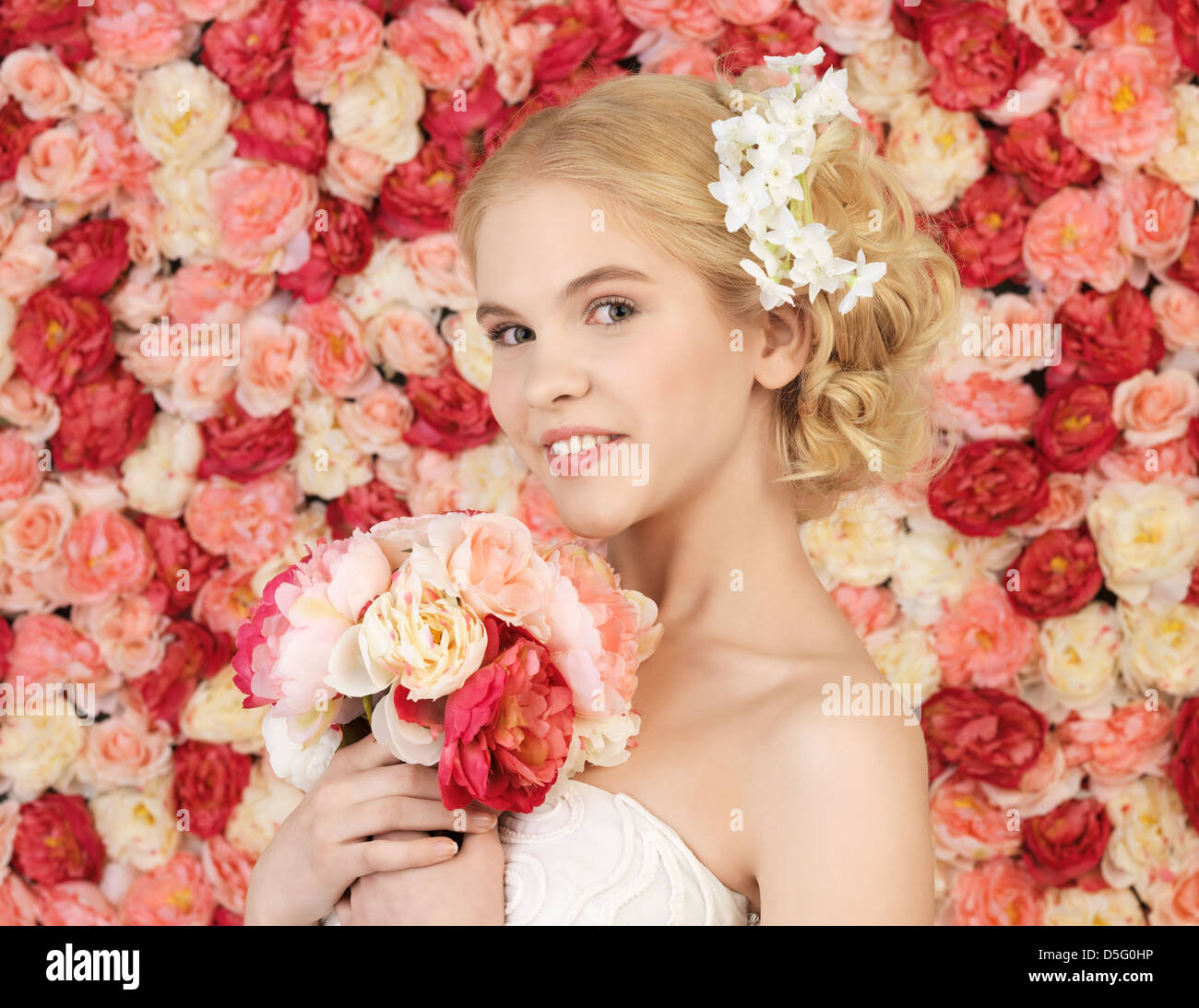 woman with bouquet and background full of roses Stock Photo - Alamy