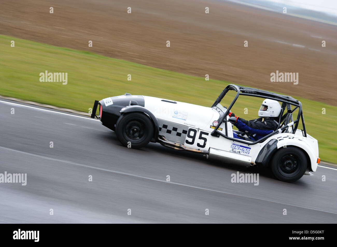 A car racing around Castle Combe Circuit at the Bristol Motor Club's ...