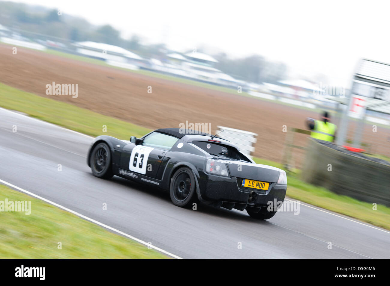 A car racing around Castle Combe Circuit at the Bristol Motor Club's ...