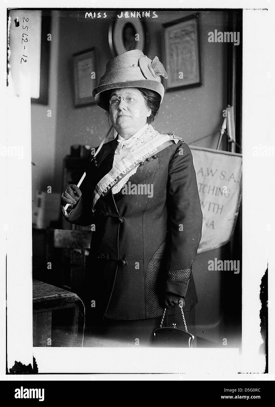 A photograph of Miss Jenkins, an advocate for women's suffrage, holding ...