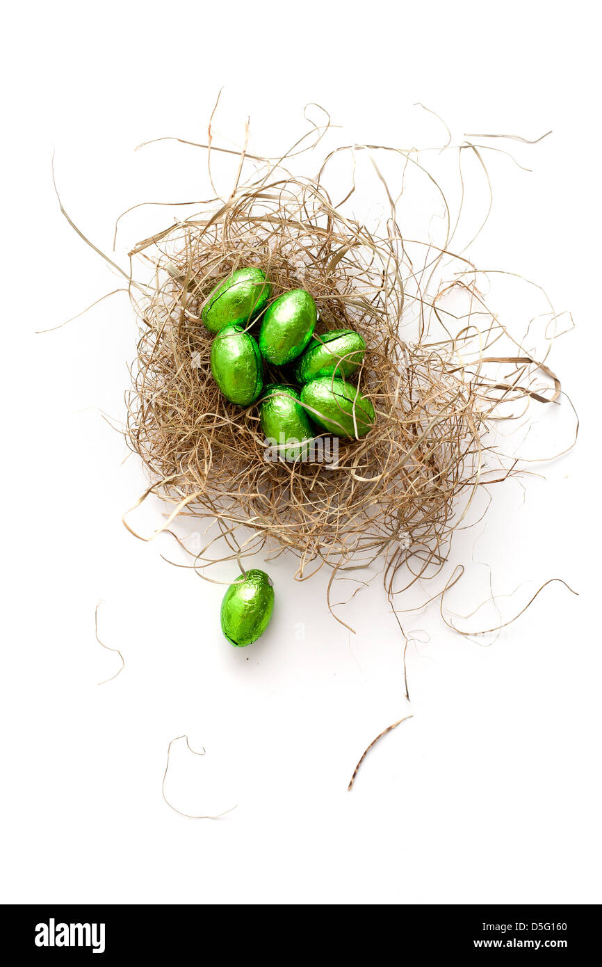 Green easter eggs in nest, isolated on white Stock Photo - Alamy