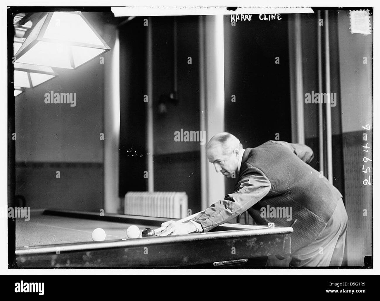 Harry Cline is pictured engaging in a game of billiards. The photograph ...