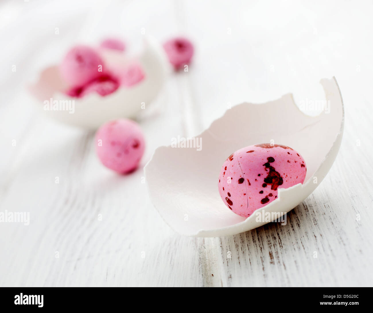 Broken egg shell with pink easter eggs Stock Photo - Alamy