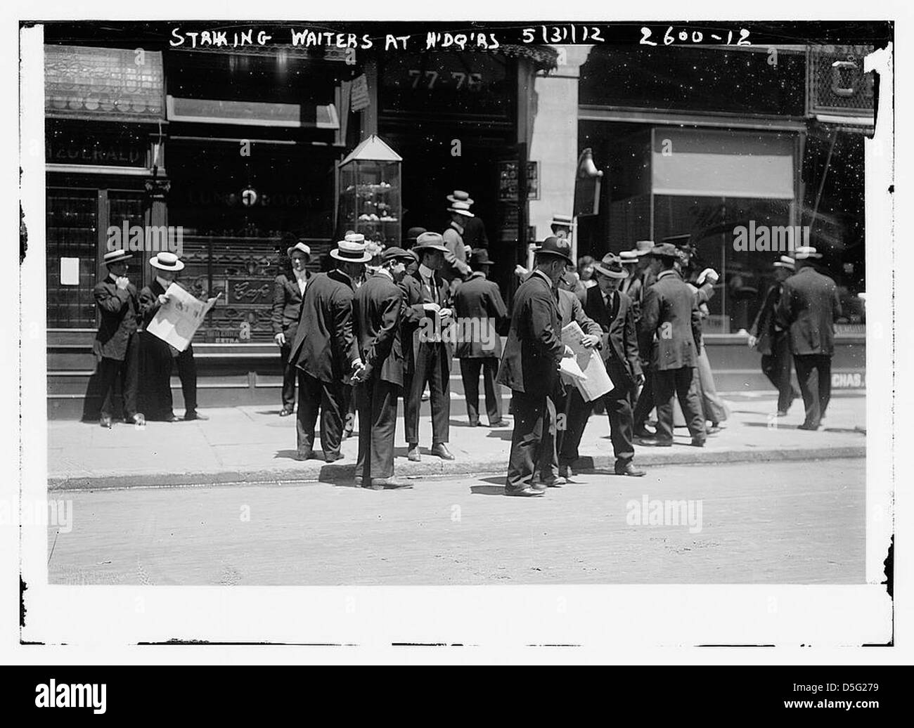 A photograph showing waiters on strike at their headquarters. This ...