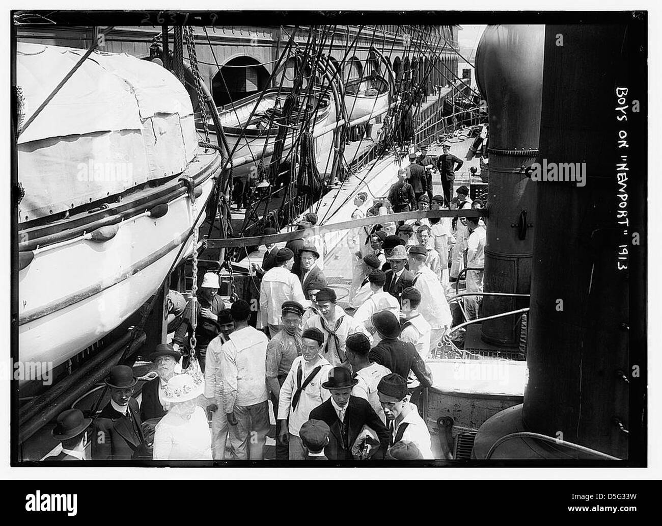 Boys aboard the USS Newport, an Annapolis-class gunboat, as part of a ...