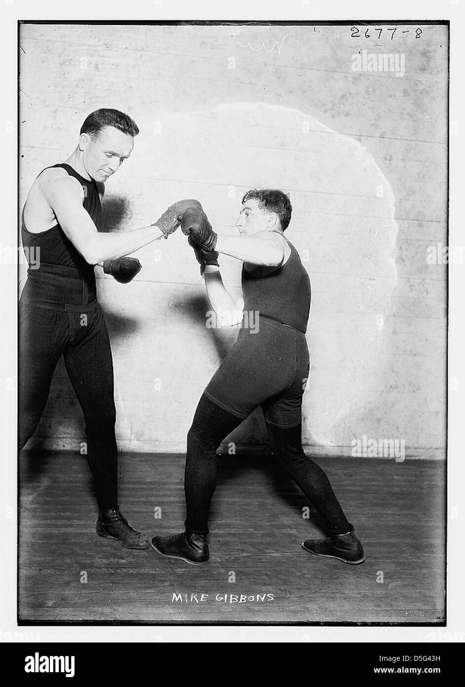 Mike Gibbons, a professional boxer, is seen practicing sparring with ...