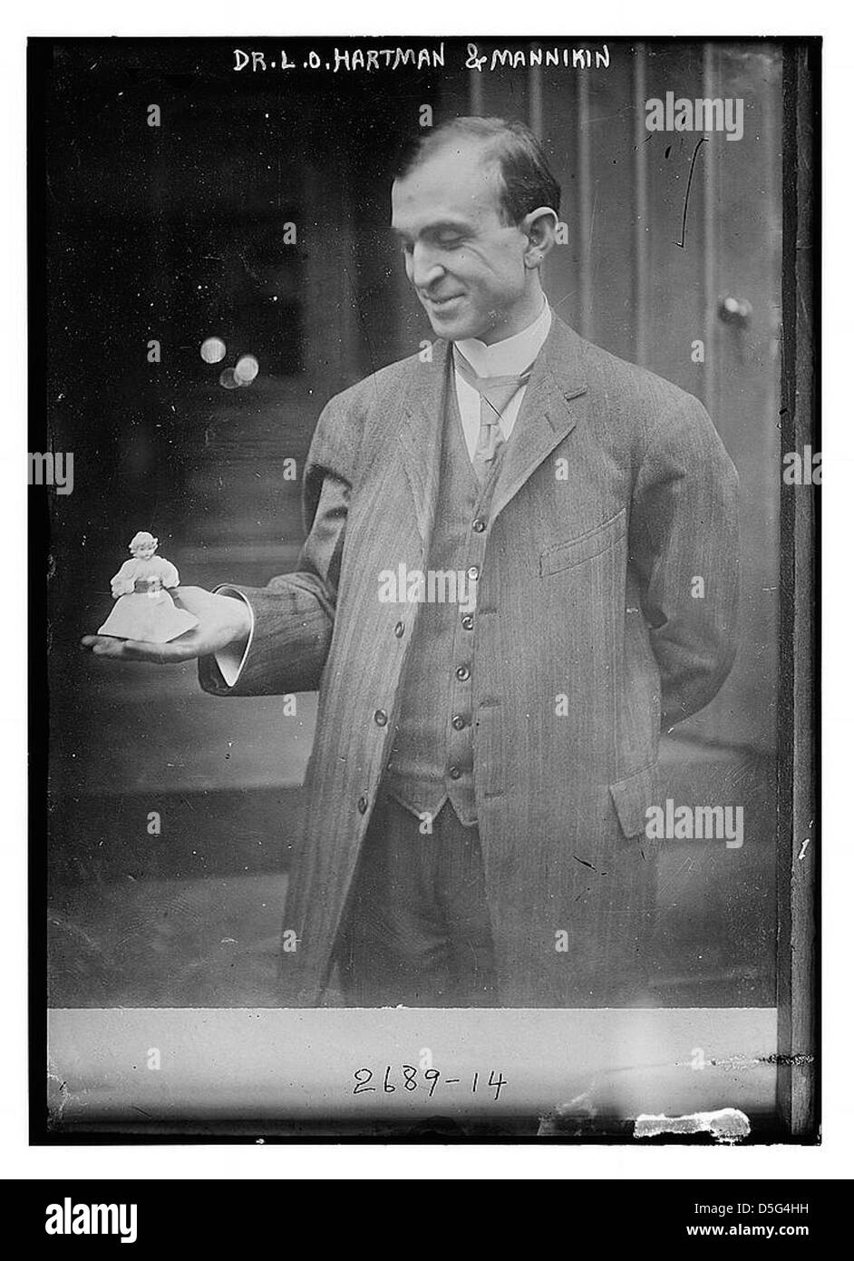 Dr. L.O. Hartman is pictured with a mannekin, a scientific model ...