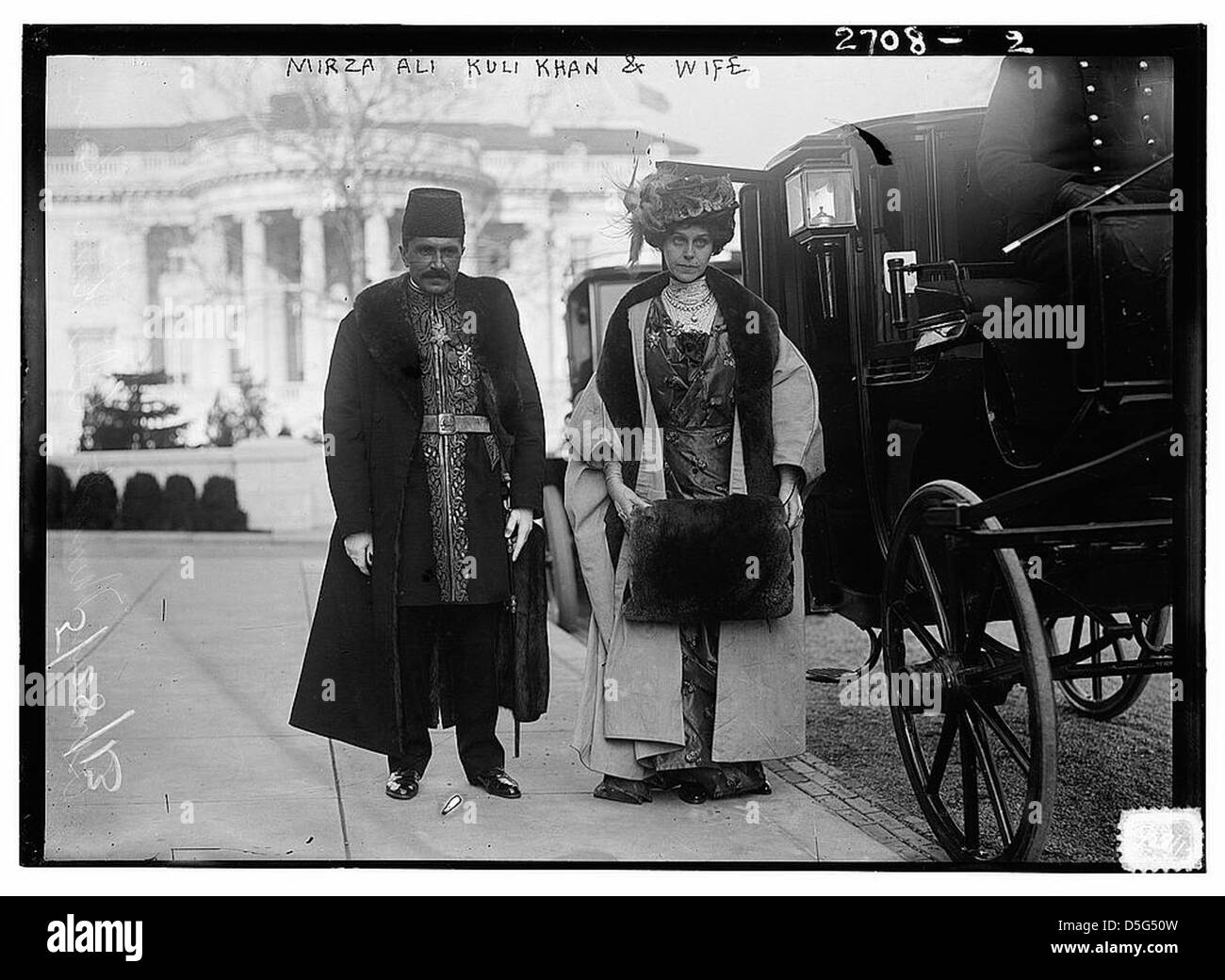 This early 20th-century photograph features Mirza Ali Kuli Khan and his ...