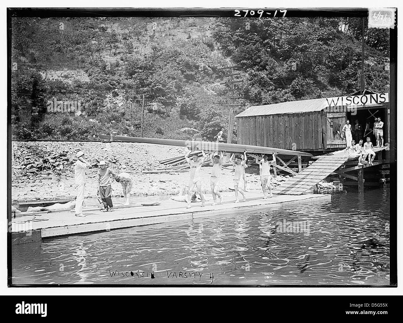This photograph shows the Wisconsin Varsity 4 rowing team in action ...