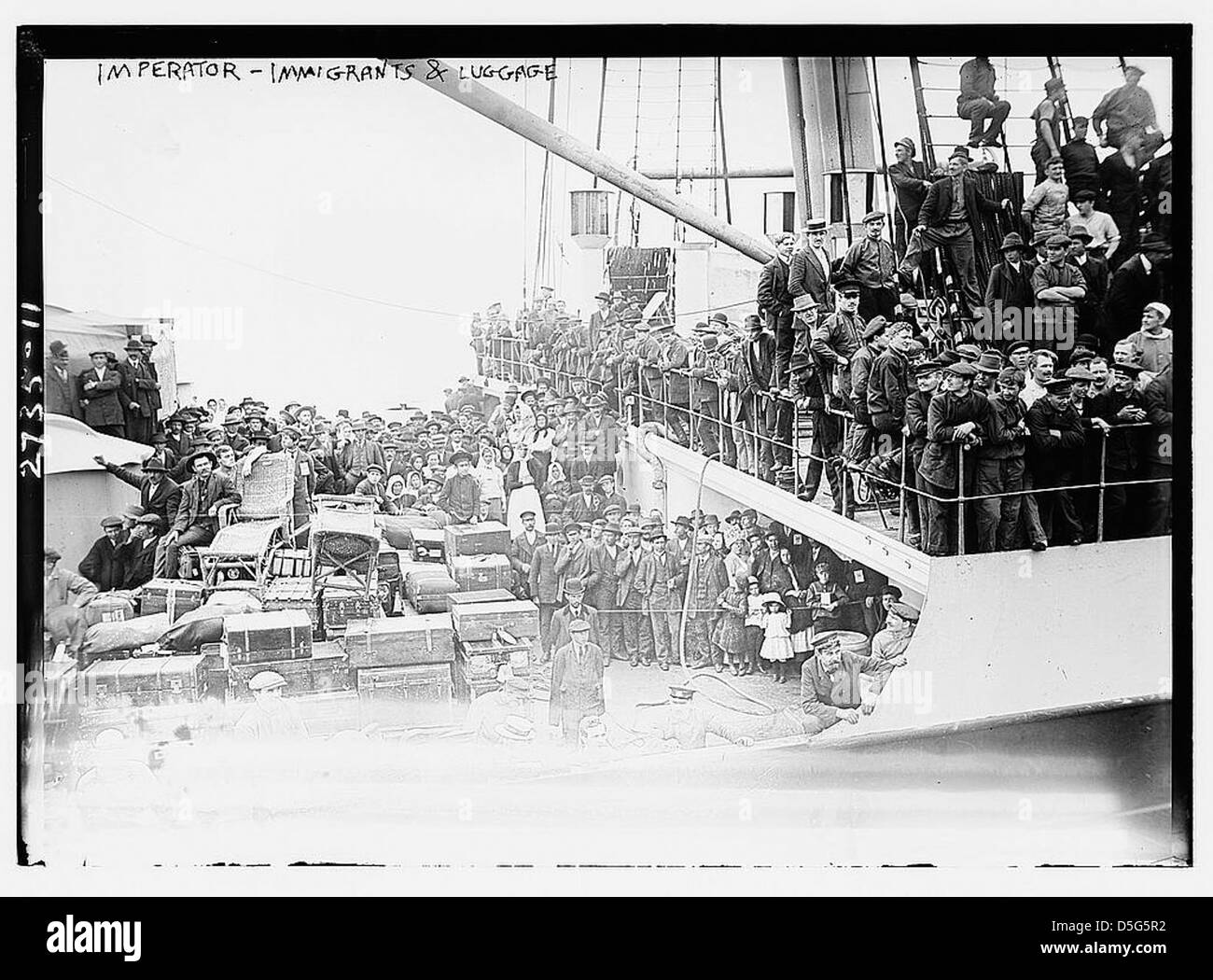 This photograph from 1913 depicts immigrants boarding the RMS Imperator ...