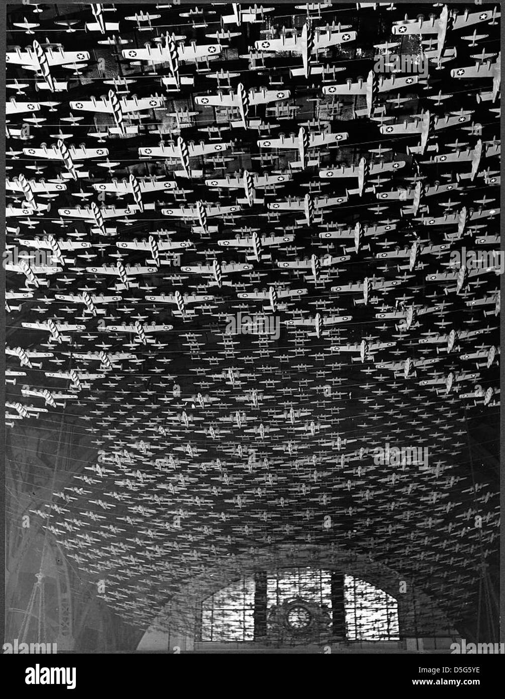 A 1943 photograph showing model airplanes suspended from the ceiling of ...