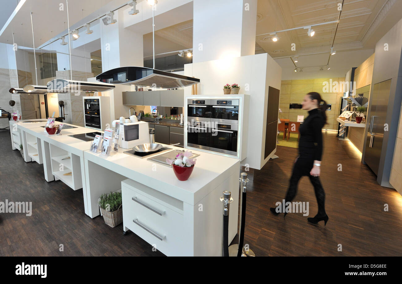 A woman walks past the so-called 'active kitchen', where one can take ...