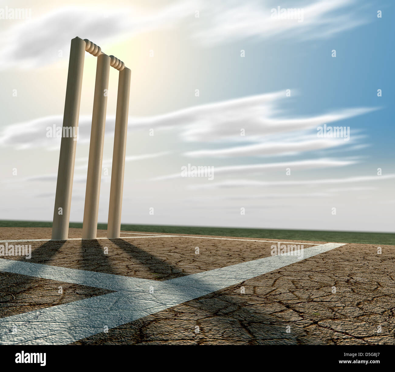 A set of cricket wickets set up on a cracked cricket pitch with white ...