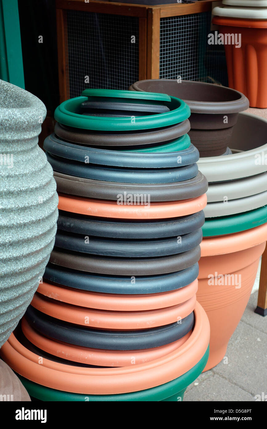 Plastic plant pots on display in the street outside hardware shop Stock ...