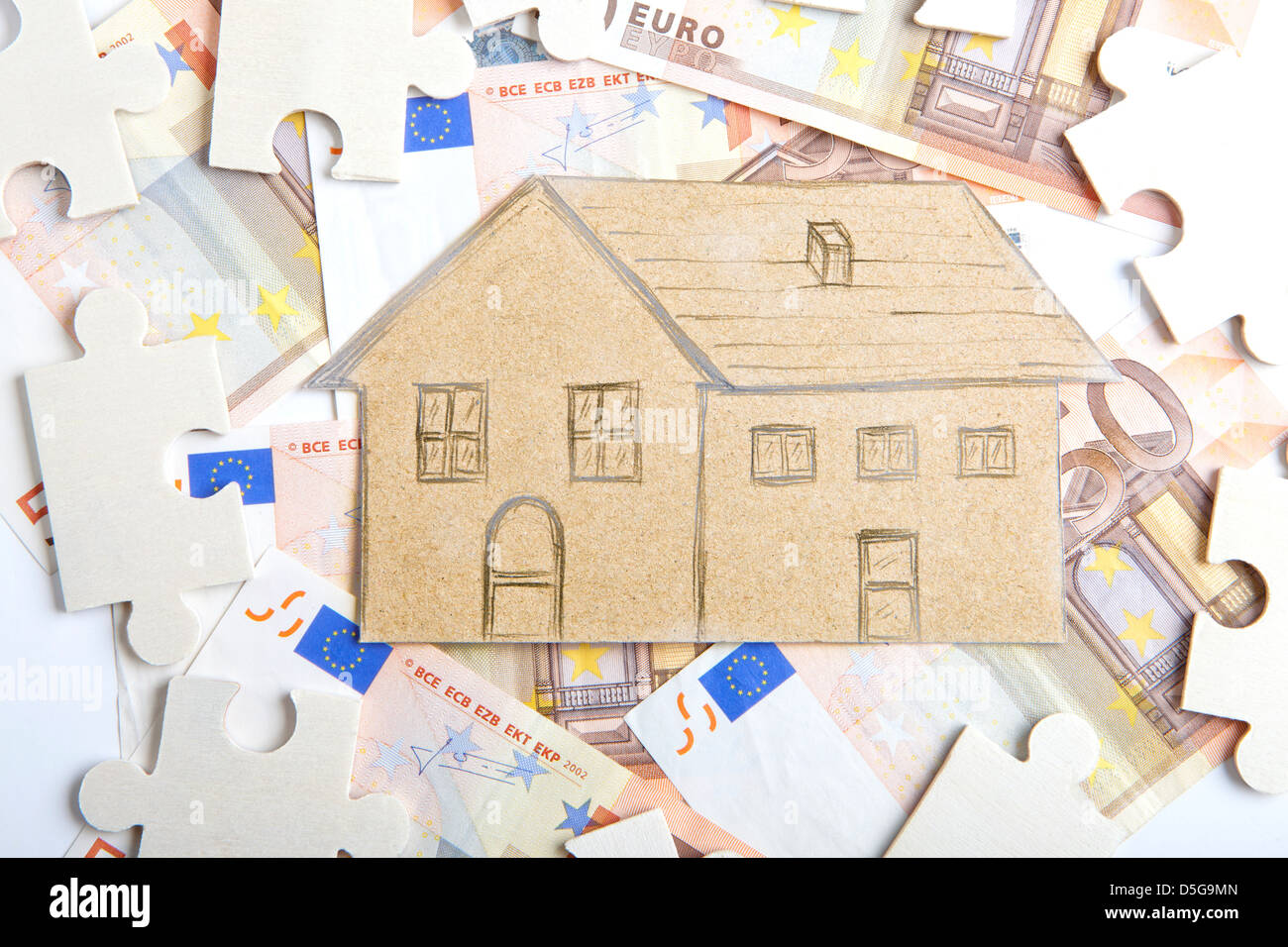 house,puzzle and money Stock Photo - Alamy