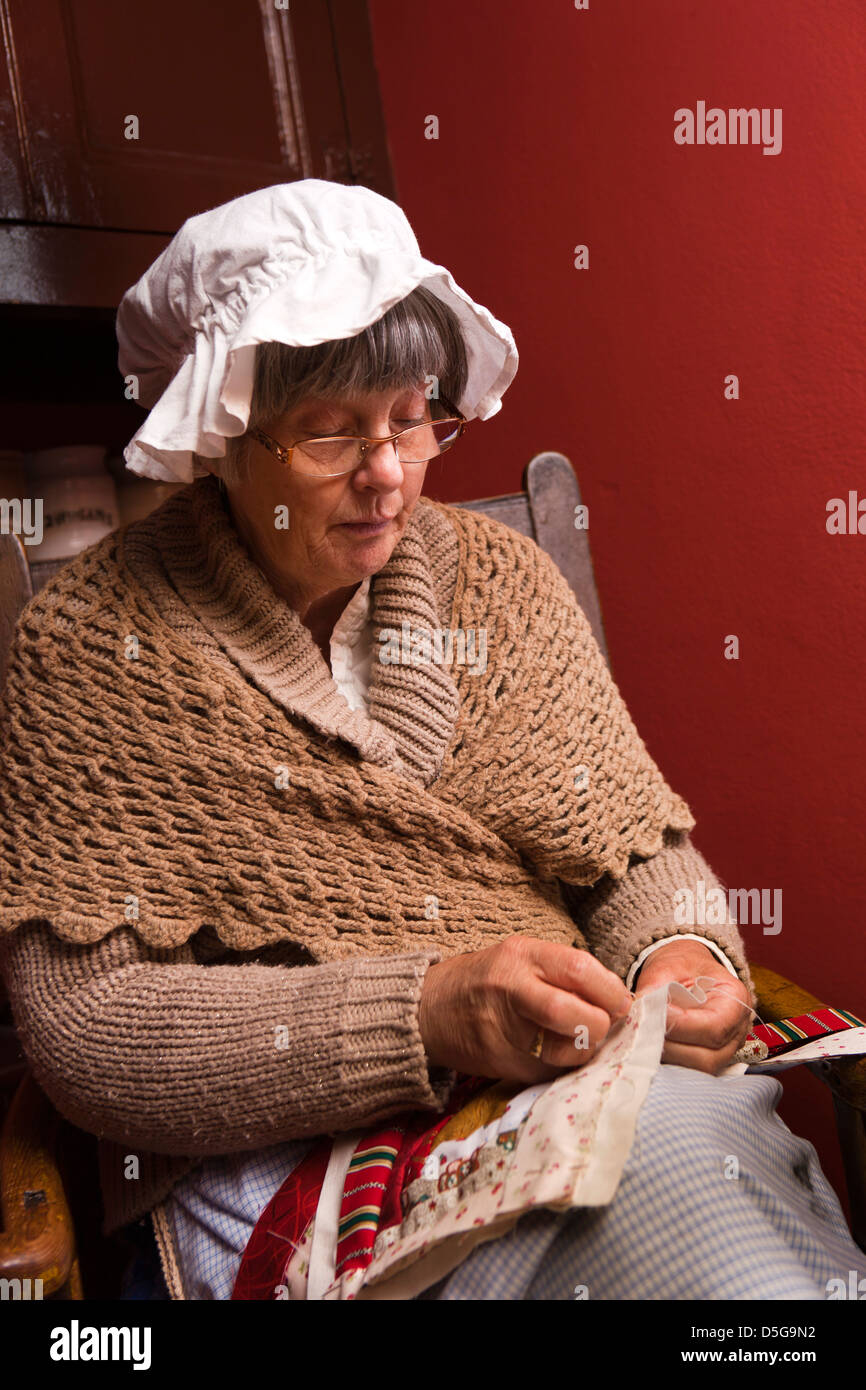 Isle of Man, Cregneash, Manx Heritage village folk museum, woman sewing ...