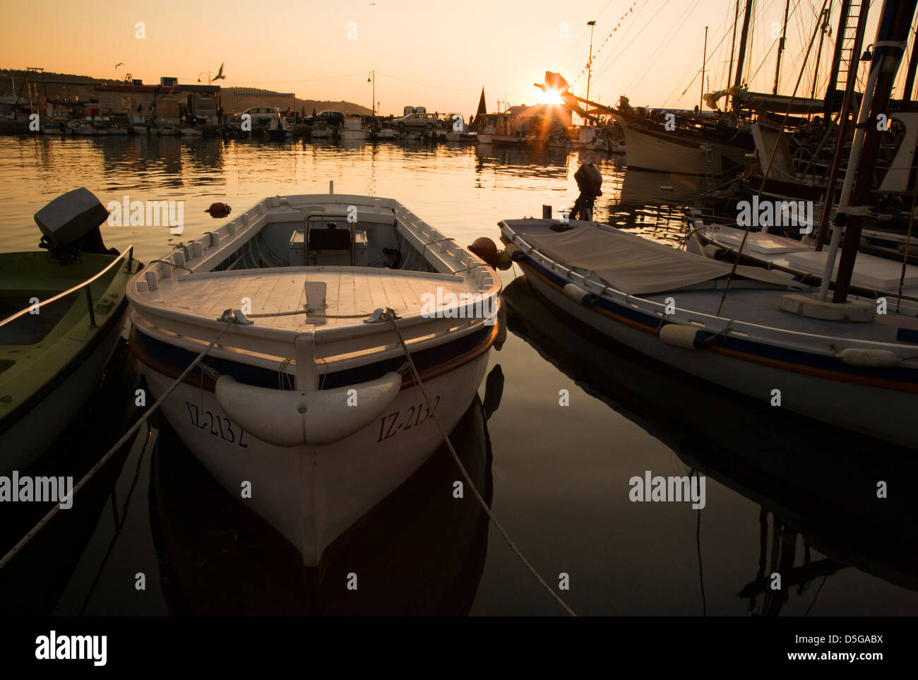 Sun setting over Izola harbour, Slovenia Stock Photo - Alamy