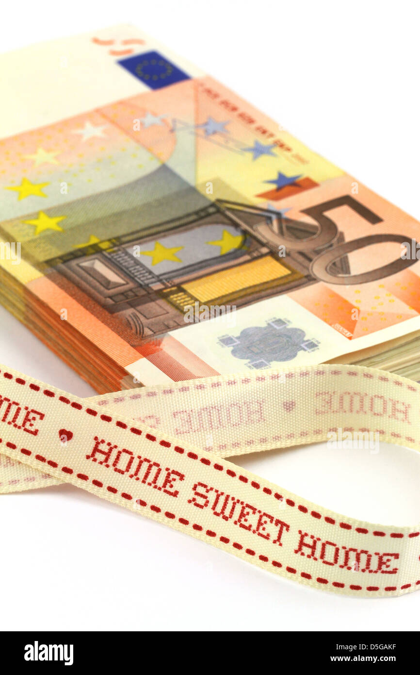 Stack of banknotes and "home sweet home" ribbon Stock Photo - Alamy