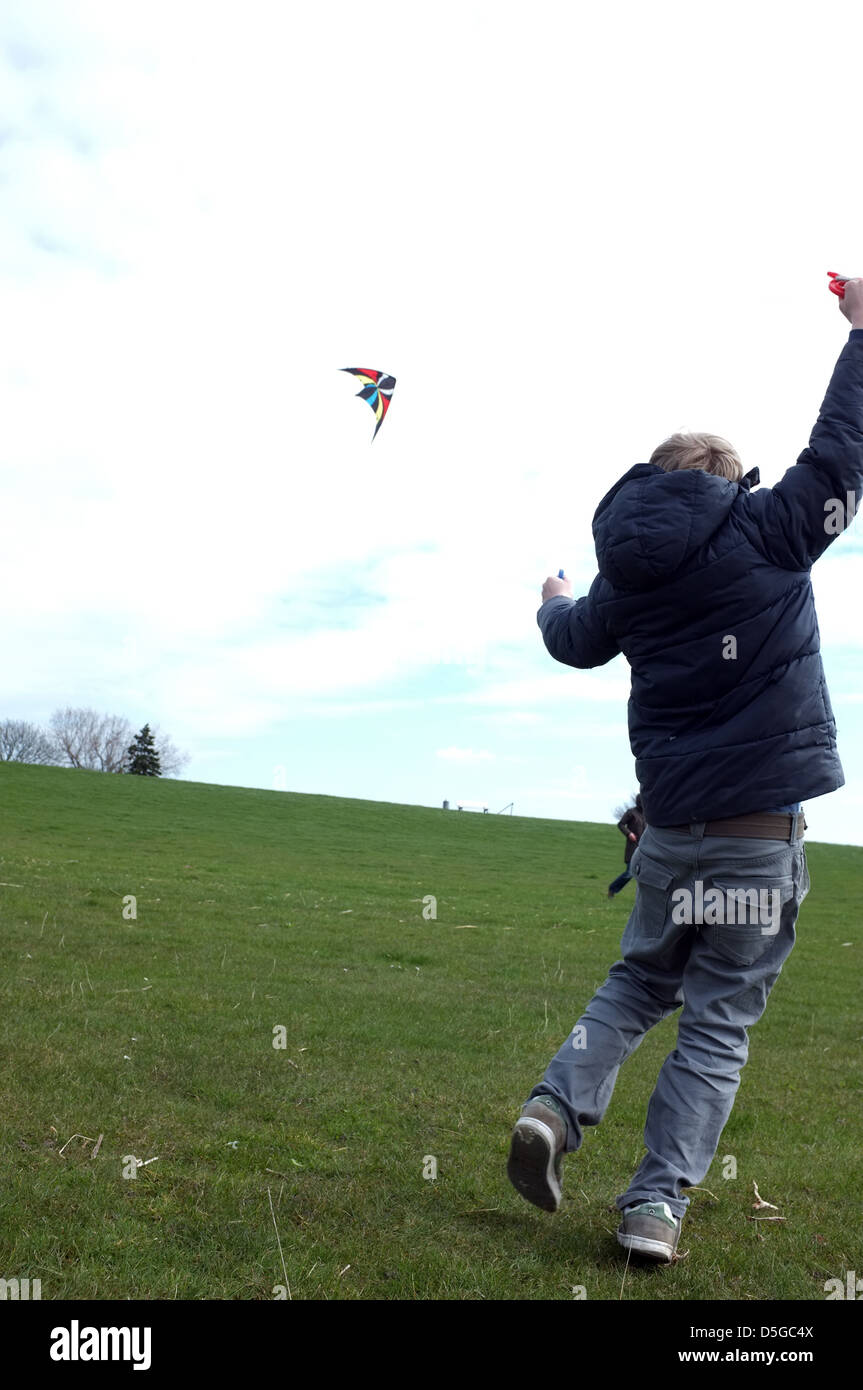 Young boy is flying his kite Stock Photo - Alamy