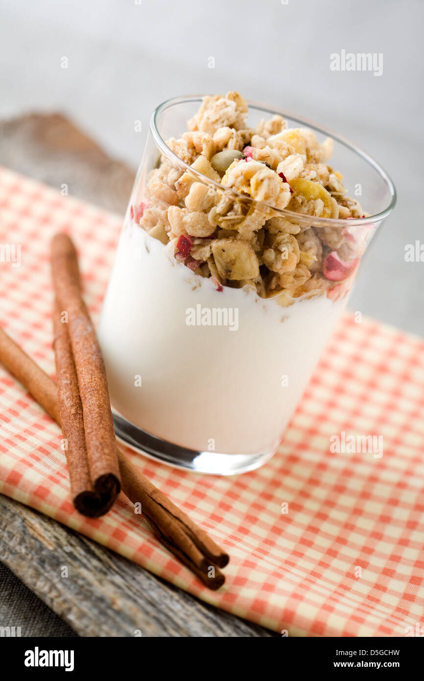 Natural yogurt with muesli in small glass Stock Photo - Alamy